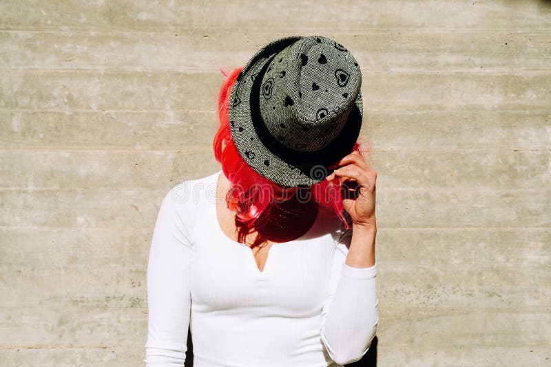 Woman Covers Her Face with a Hat Stock Image - Image of holiday, blue ...