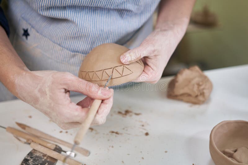 Woman Creates Pattern on a Clay Pot by Hands in Artistic Studio Stock ...