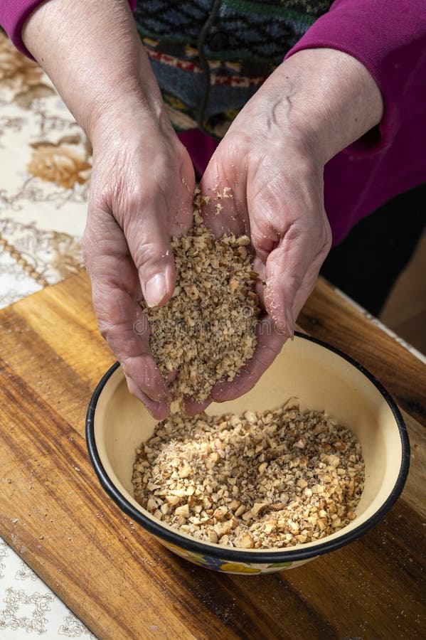 Woman Crushing Nuts for Baking Stock Photo - Image of homemade, crushed ...