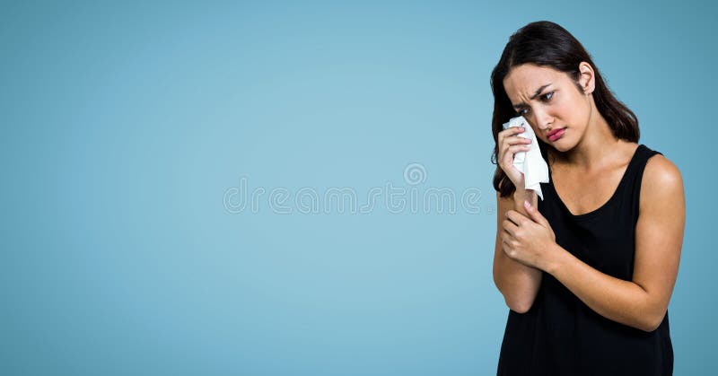 Woman Crying into Tissue Against Blue Background Stock Photo - Image of ...