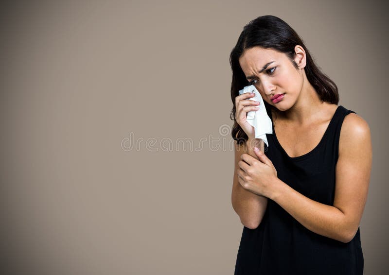 Woman Crying into Tissue Against Brown Background Stock Photo - Image ...