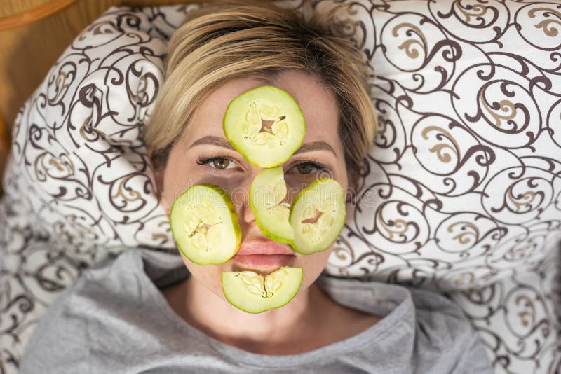 A Woman with a Cucumber on Her Face Stock Image - Image of cosmetology ...