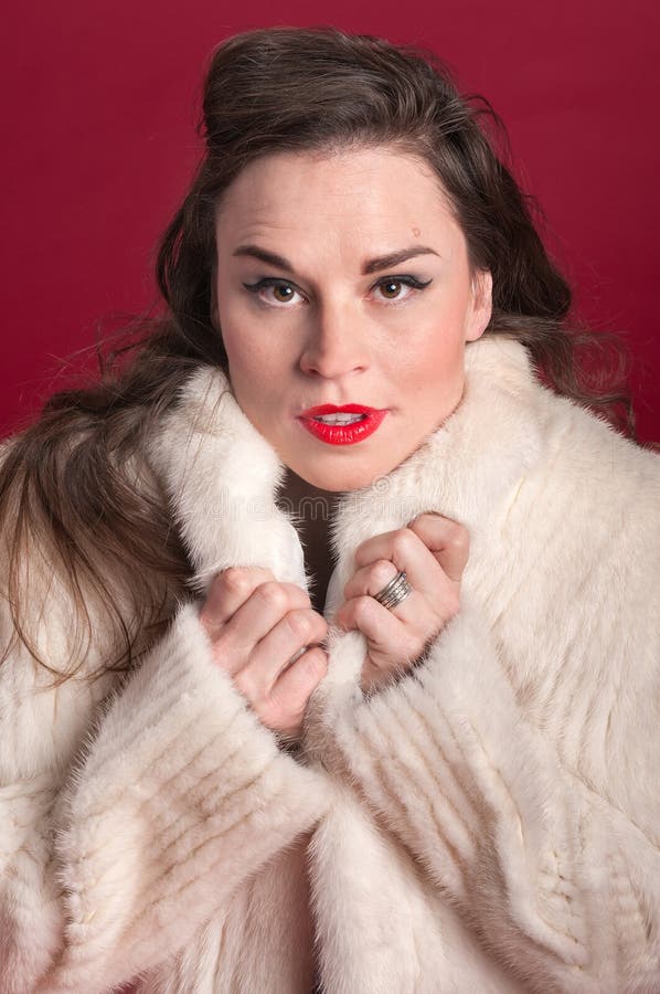 Coy Pinup Girl in Fur Coat stock image. Image of attractive - 35132853