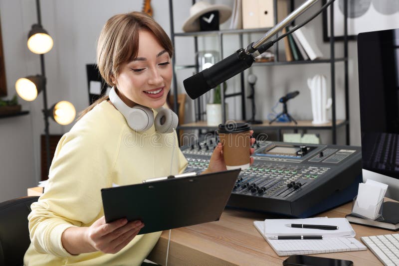 Woman with Cup of Coffee Working As Radio Host in Modern Studio Stock ...