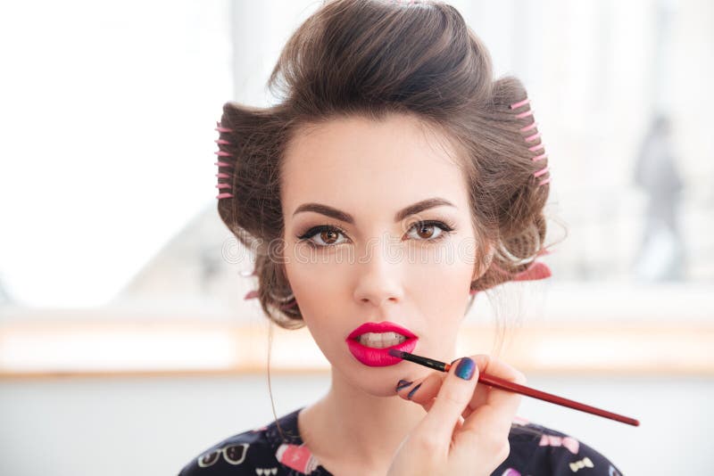 Professional Visagist In Beauty Salon Gets Makeup For Beautiful Woman