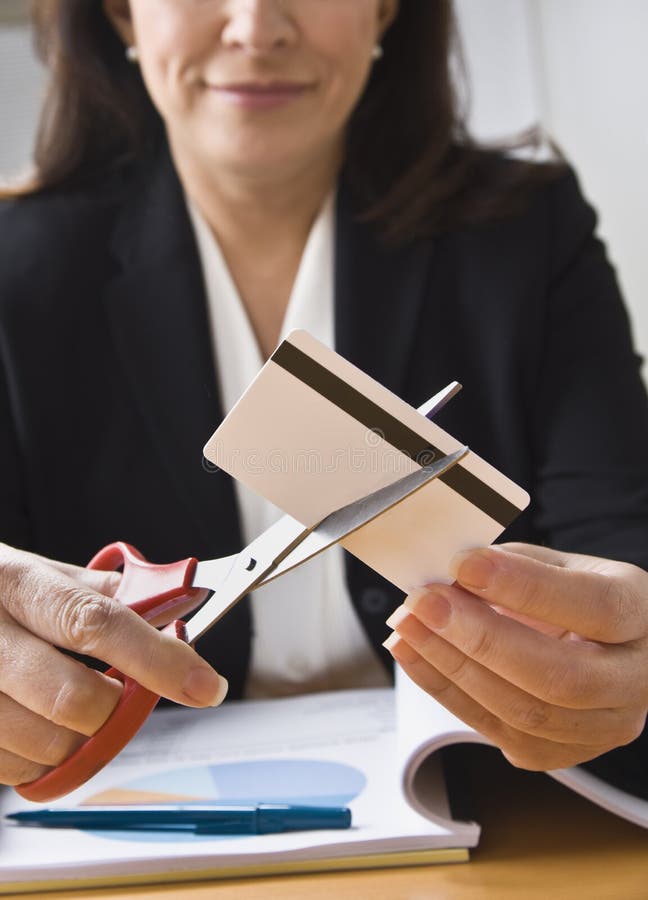 Woman Cutting Credit Card stock image. Image of businesswoman - 10092807