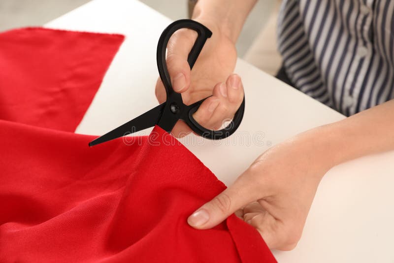 Woman Cutting Fabric with Sharp Scissors at White Table Stock Photo ...