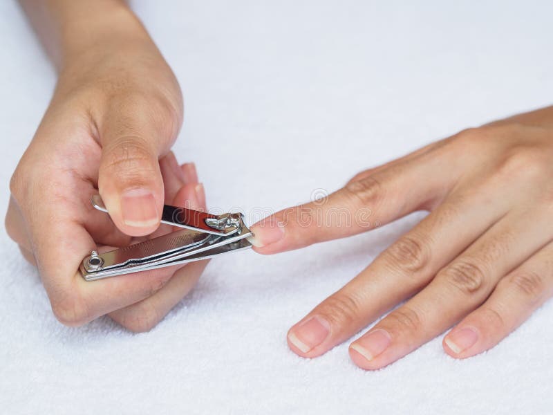 Woman Cutting Nails Using Nail Clipper On White Background Heal Stock