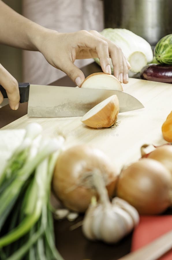 Woman cutting vegetables stock photo. Image of colorful - 49572242