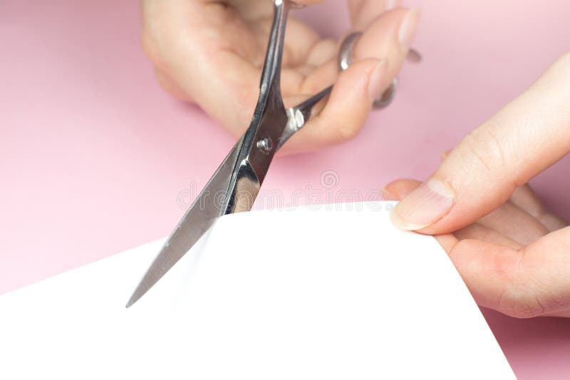 Woman is Cutting White Paper with Scissors, Close Up Stock Photo ...