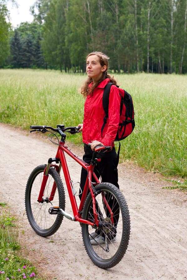 Woman Cyclist on a Bicycle Walk on the Nature Stock Photo - Image of ...