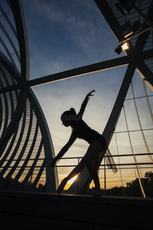 Woman Dancing Classical Ballet on a Bridge at Dawn Stock Photo - Image ...