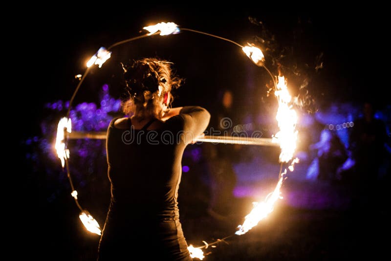 Woman dancing with fire editorial image. Image of night - 121747070