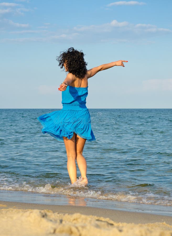 Woman dancing in the sea stock photo. Image of enjoy - 26168294