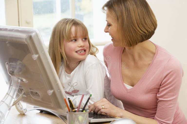 Woman and Daughter Using Computer Stock Photo - Image of concentrating ...