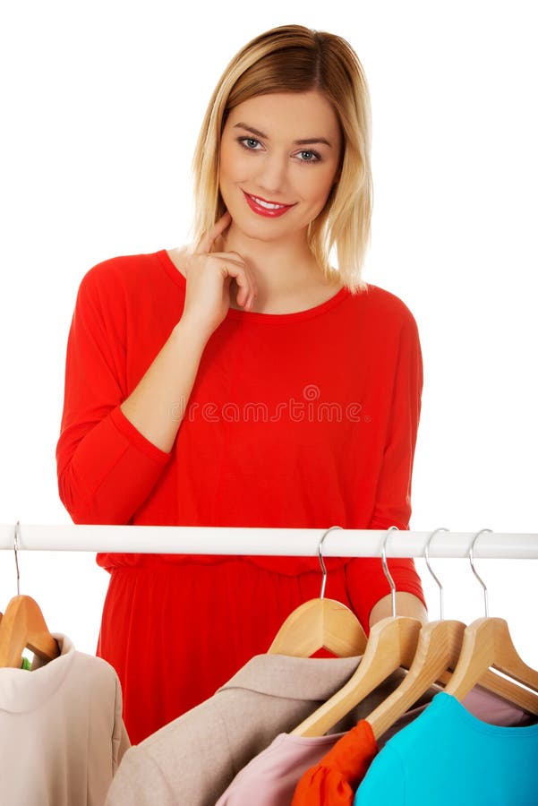 Woman Deciding What To Put on. Stock Image - Image of tense, home: 55420727