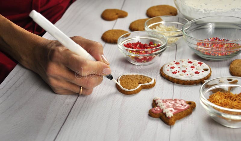 Woman Decorate Gingerbread Cookies. Christmas Bakery. Festive Icing ...