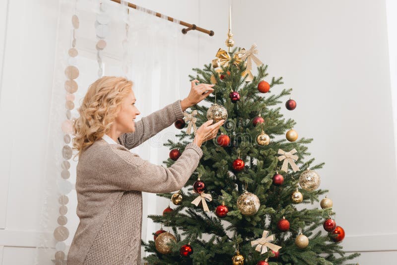Woman Decorating Christmas Tree Stock Image - Image of gorgeous, adult ...