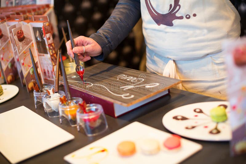 Woman Decorating Plate for a Dessert Stock Photo - Image of action ...