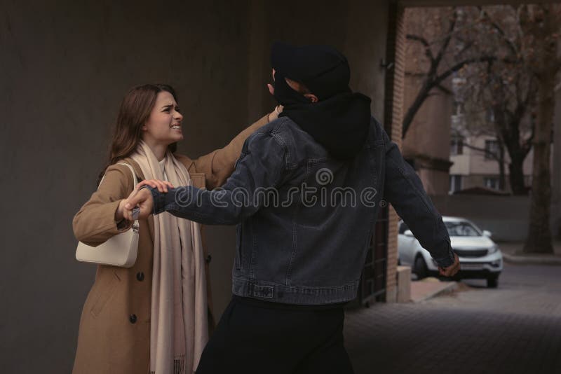 Woman Defending Herself from Attacker with Knife in Alley Stock Image ...