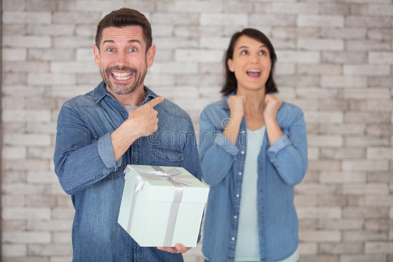Woman Delighted with Gift from Husband Stock Photo - Image of ...