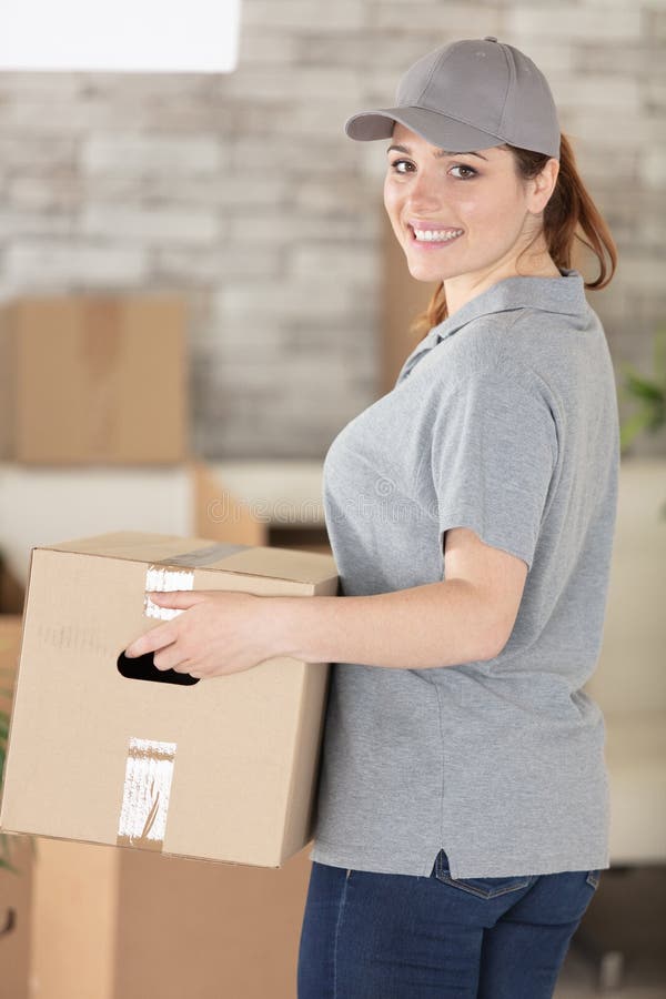 Woman with delivery boxes stock photo. Image of document - 258548852