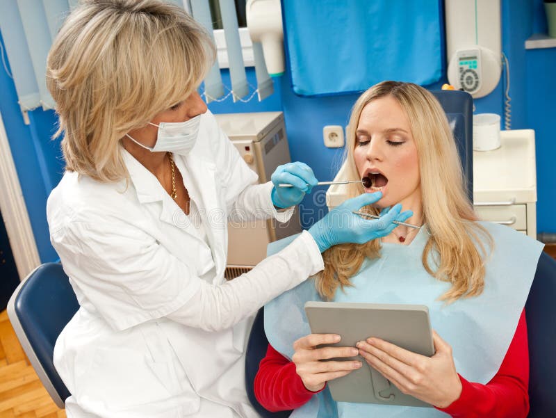 Dentist at work stock photo. Image of caucasian, mouth - 15838784
