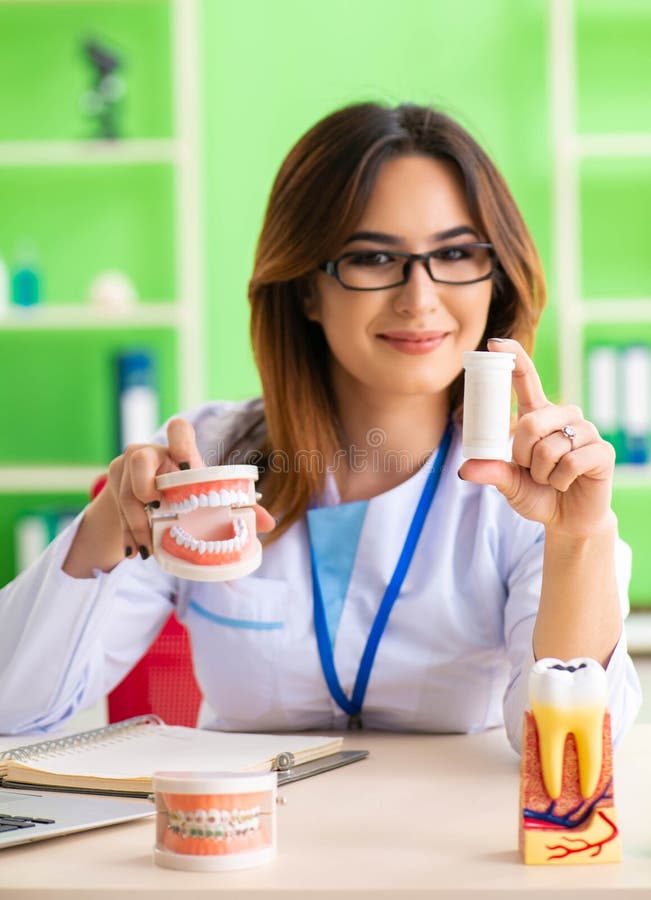 Woman Dentist Working on Teeth Implant Stock Image - Image of ...