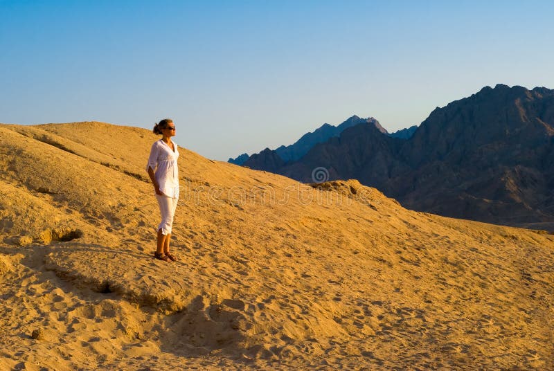 Woman in the desert stock photo. Image of heat, real - 12496944