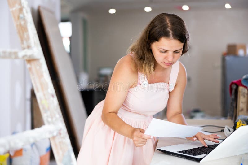Woman Designer Using Laptop in Construction Site Stock Photo - Image of ...