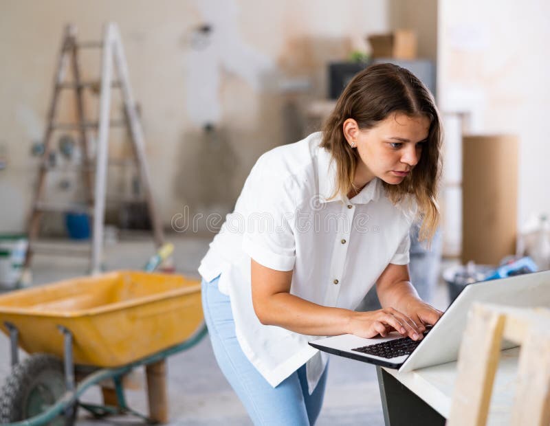 Woman Designer Using Laptop in Construction Site Stock Photo - Image of ...