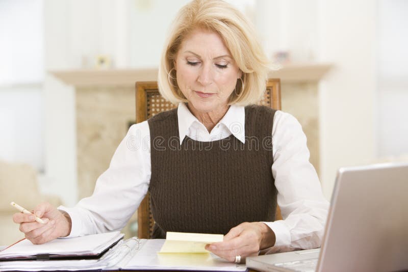 Businessman Filling Out Paperwork at Desk Stock Photo - Image of ...