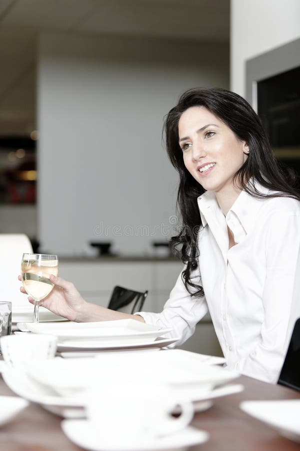 Woman at the dinner table stock image. Image of restaurant - 33521985