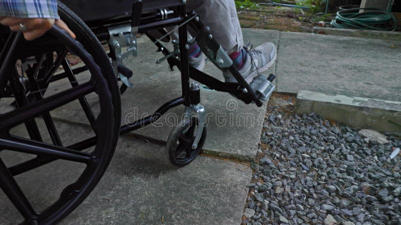 A Woman with a Disability, Using a Wheelchair, Encounters an Obstacle ...