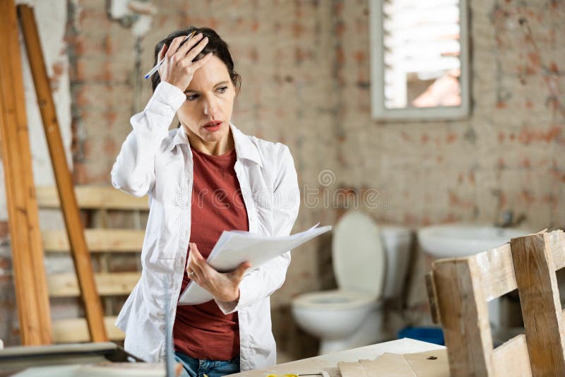 Woman Dissatisfied with the Repair Work Done in Room Stock Photo ...