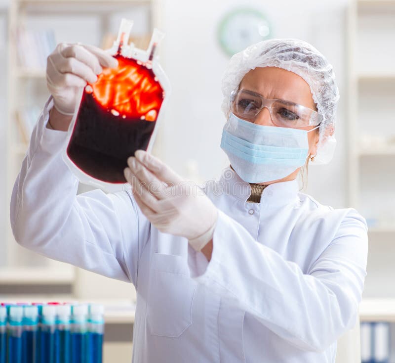 Woman Doctor Checking Blood Samples in Lab Stock Photo - Image of ...