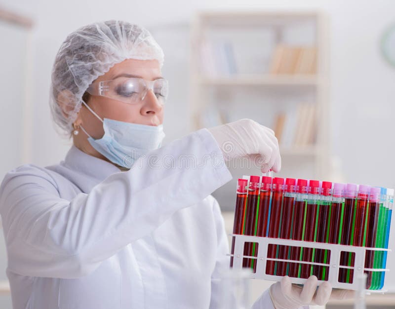 Woman Doctor Checking Blood Samples in Lab Stock Image - Image of ...