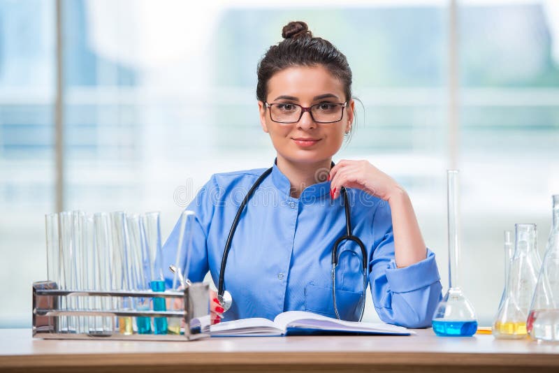 The Woman Doctor Doing Chemical Tests in Laboratory Stock Photo - Image ...