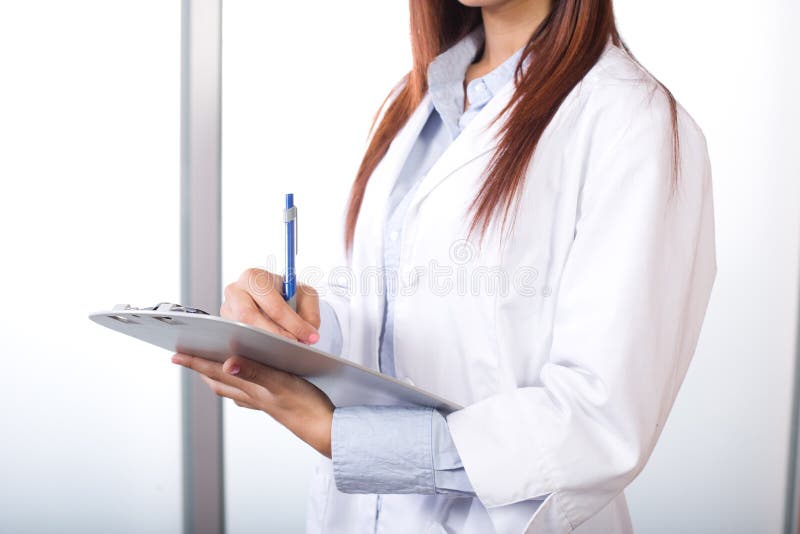 Woman Doctor Holding a Chart Stock Photo - Image of female, life: 9616306