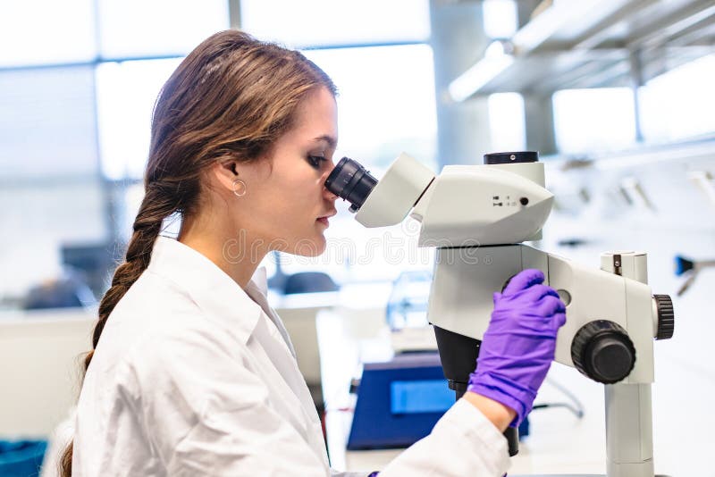 Woman Doctor in Laboratory Sitting at Microscope Stock Image - Image of ...