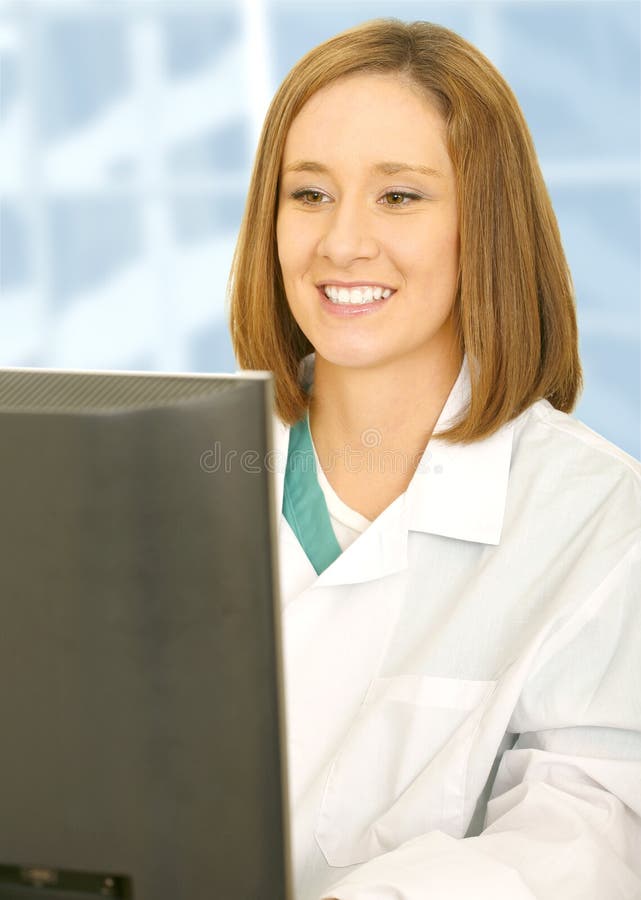 Woman Doctor Looking at Her Computer Stock Image - Image of happy ...