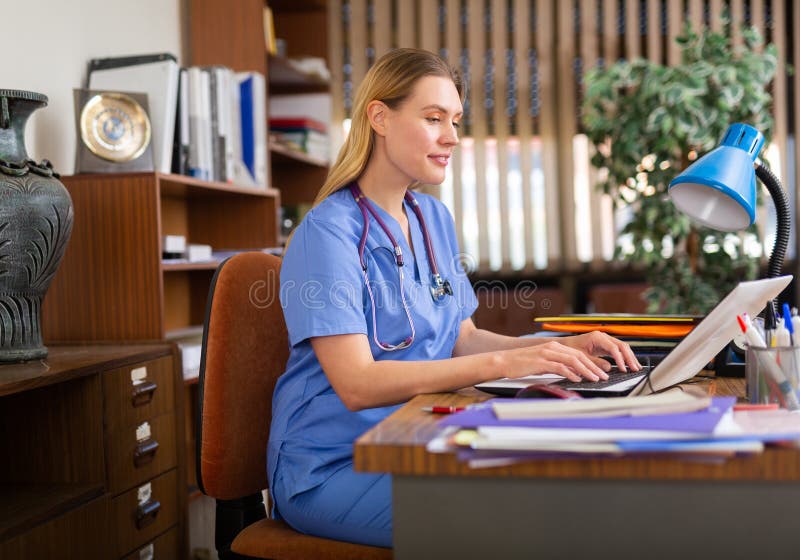 Woman Doctor Sitting at Workplace with Computer in Office Stock Image ...