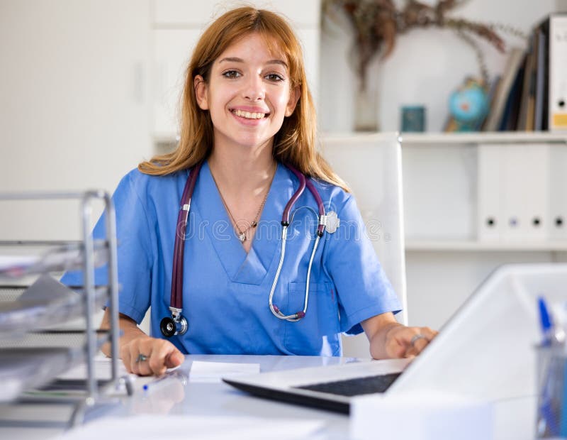Woman Doctor Sitting at Workplace with Computer in Her Office Stock ...