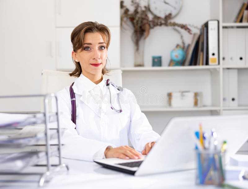 Woman Doctor Sitting at Workplace with Computer in Office Stock Image ...