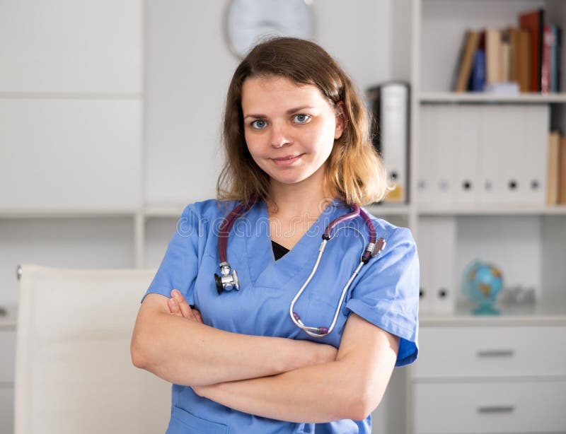 Woman Doctor Standing Inside Office, Looking at Camera Stock Photo ...