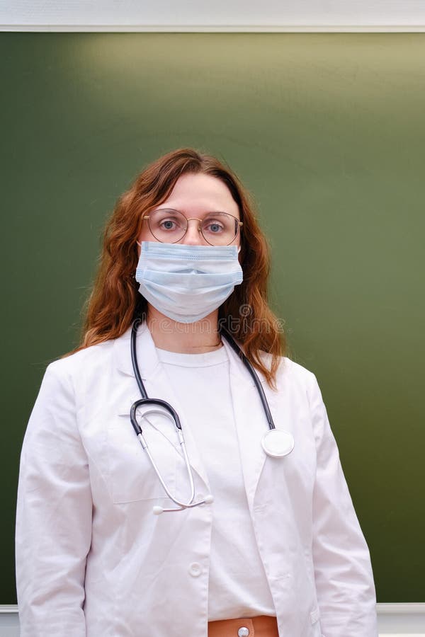 Woman Doctor Stands at the School Blackboard. the Problem with Lessons ...
