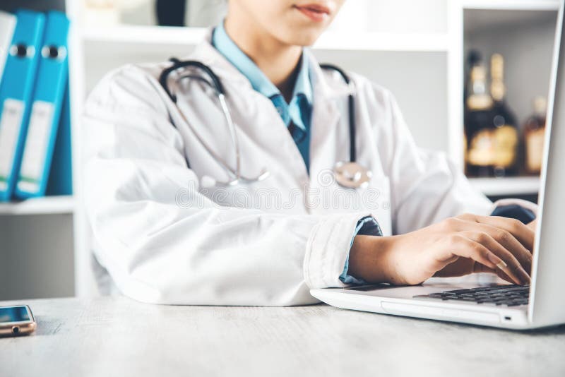 Woman Doctor Working Computer in the Hospital. Stock Image - Image of ...