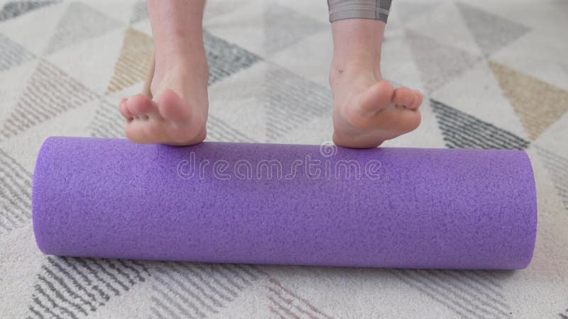 A Woman Does a Foot-and-a-half-legged Exercise at Home Stock Video ...