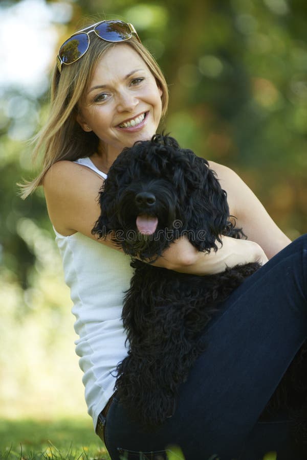 Woman walking dog stock photo. Image of park, lifestyle - 21888440