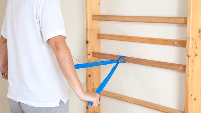 Woman Doing Exercise with Blue Elastic Ribbon Stock Photo - Image of ...